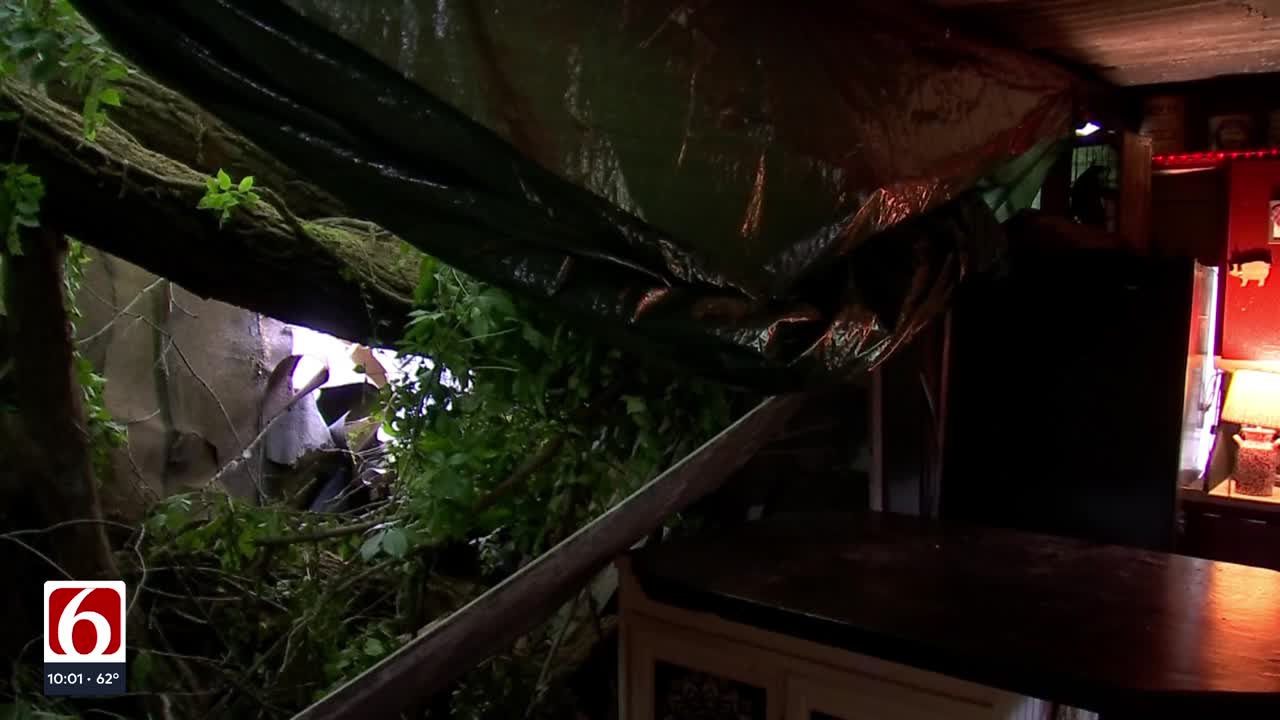 Massive tree still inside Sand Springs home nearly a week after storm